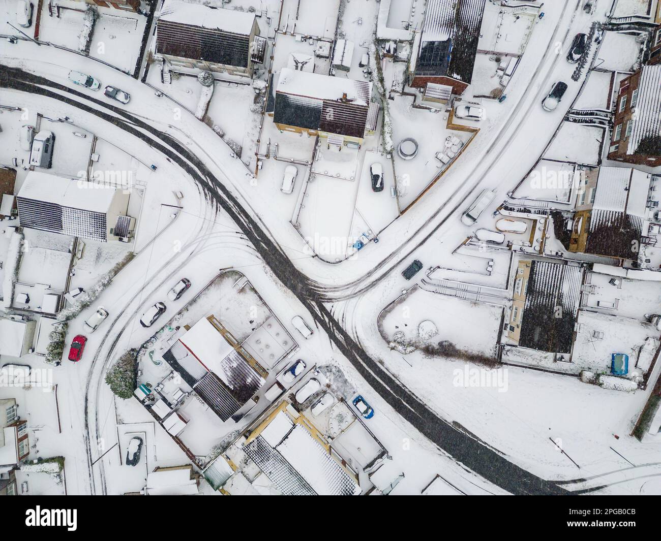 Aerial view of snow covered streets and roads during a blizzard (Wales ...