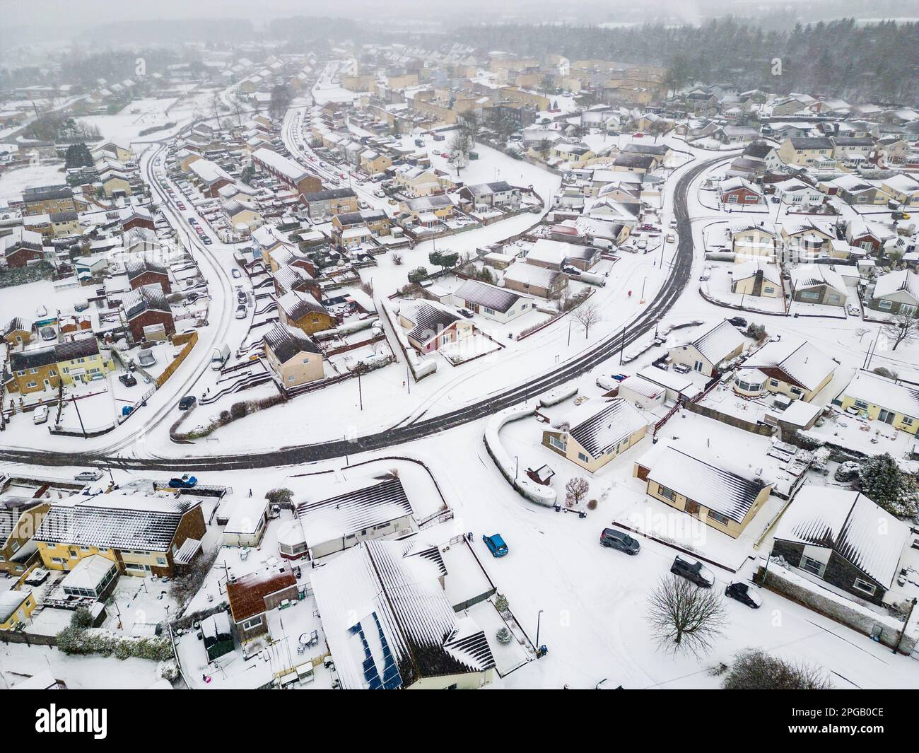 Aerial view of snow covered streets and roads during a blizzard (Wales ...
