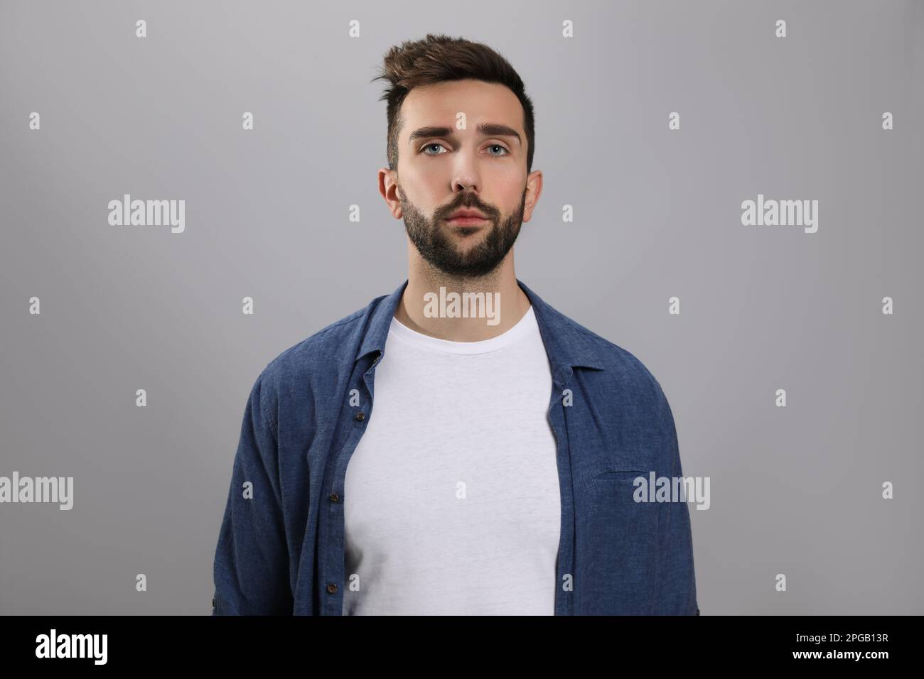 Portrait of handsome man on grey background Stock Photo - Alamy