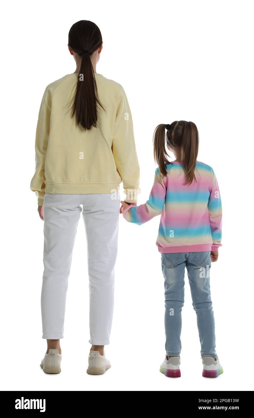 Little girl with her mother on white background, back view Stock Photo - Alamy