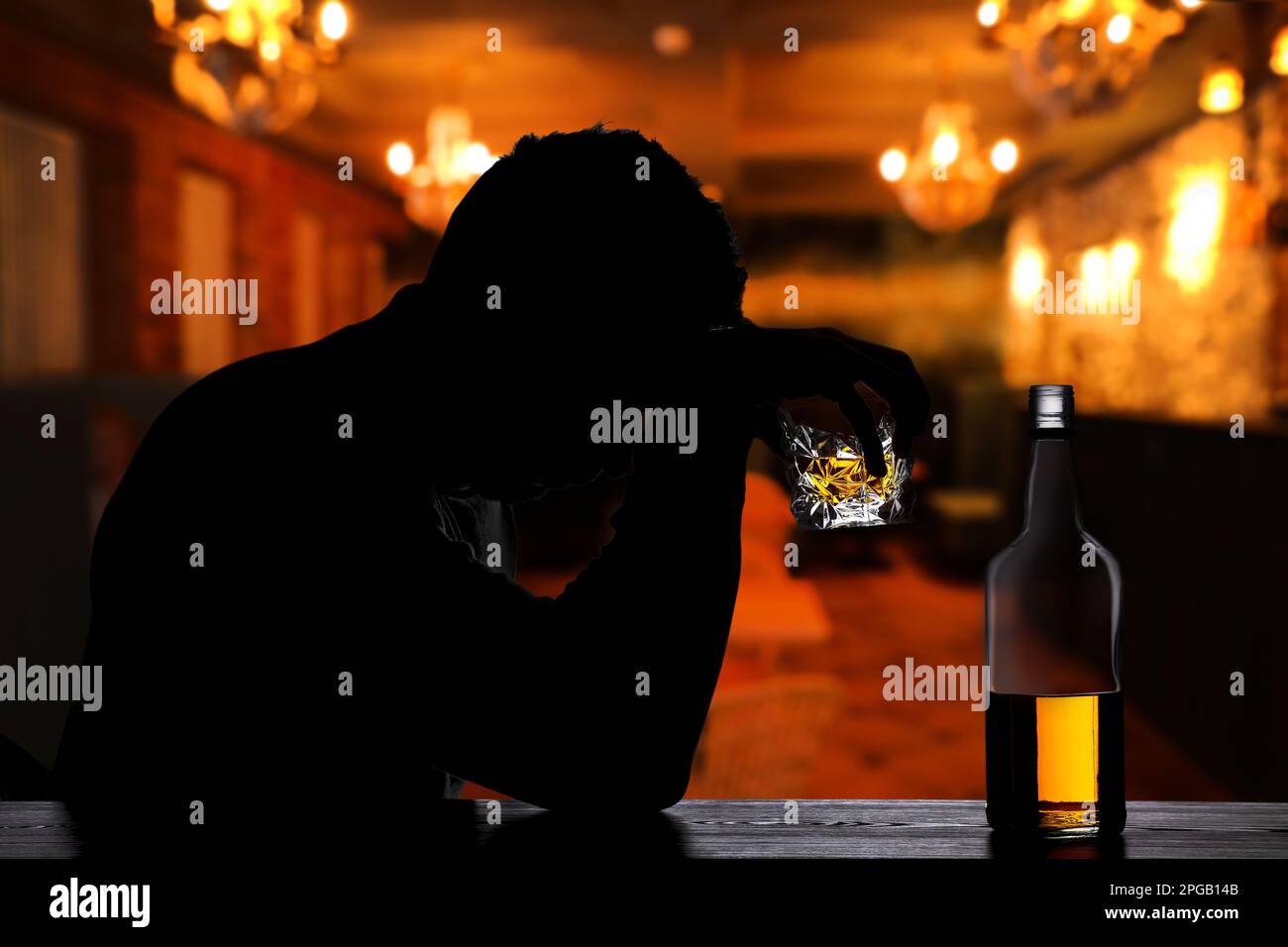 Silhouette of addicted man with alcoholic drink in bar Stock Photo - Alamy