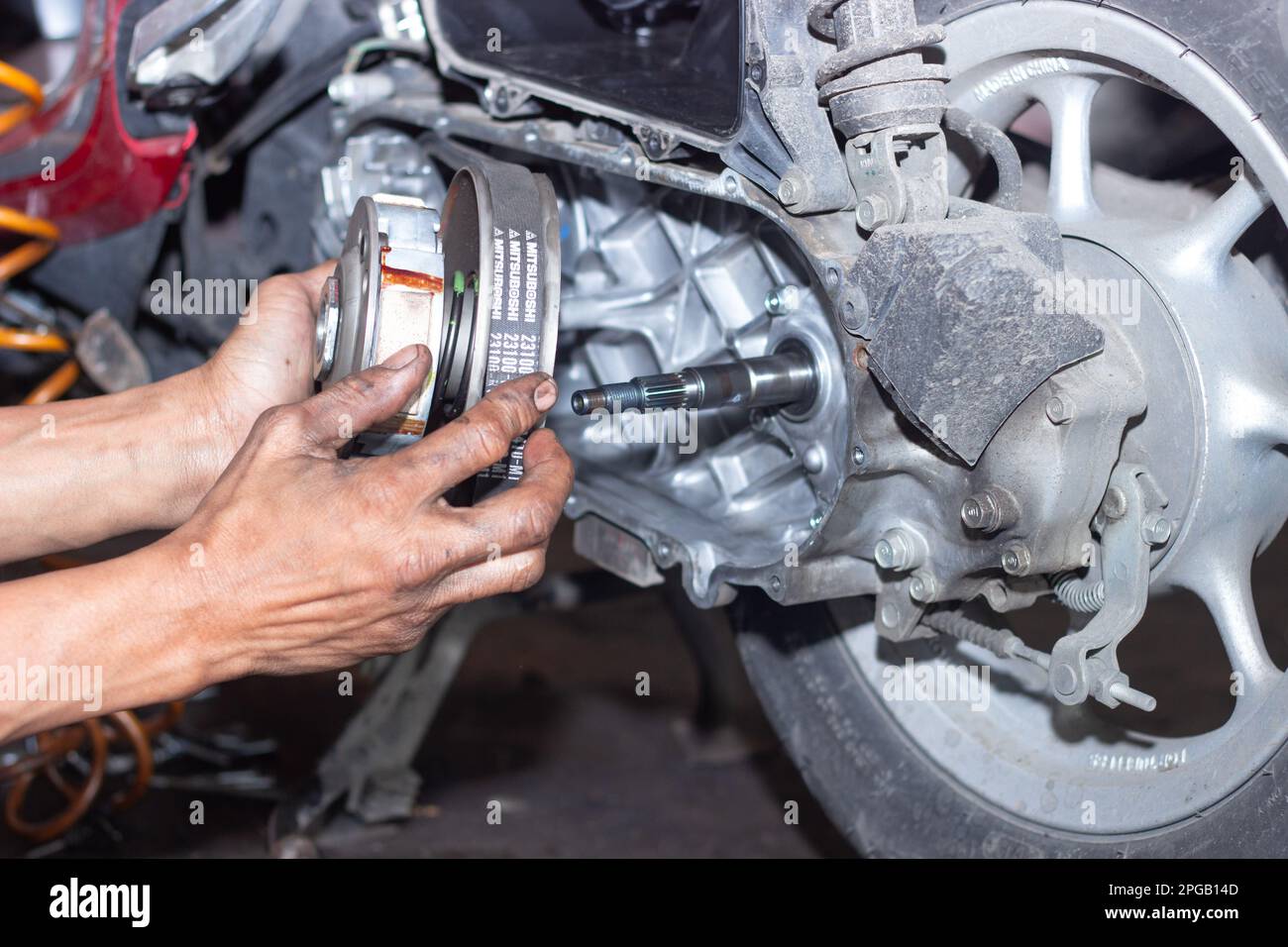 Motorcycle mechanic check the condition of Auto Transmission system or ...