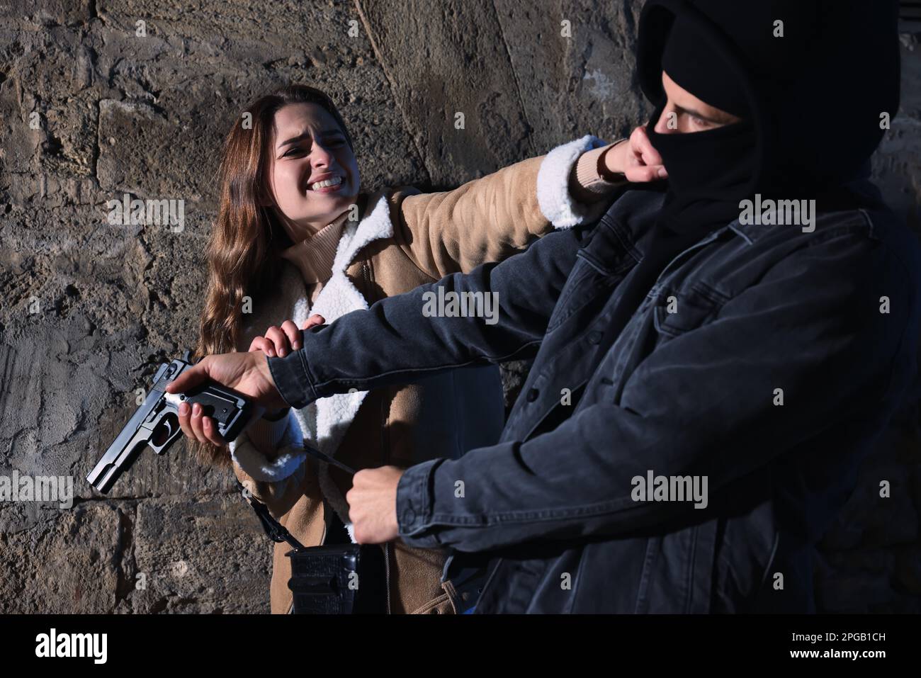 Man with gun in alley hi-res stock photography and images - Alamy