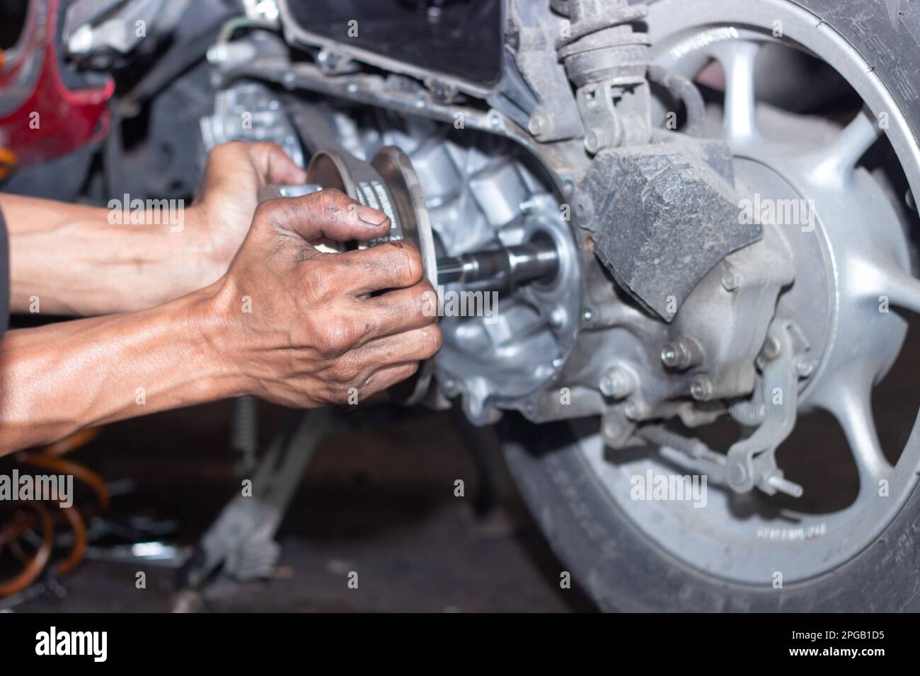 Motorcycle mechanic check the condition of Auto Transmission system or ...