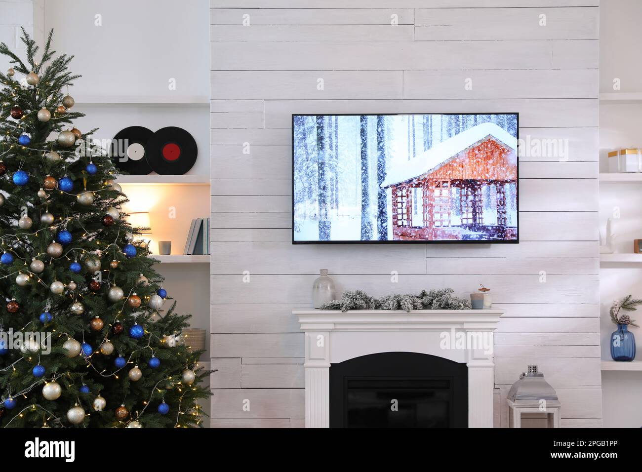 Stylish living room interior with modern TV and Christmas tree Stock ...