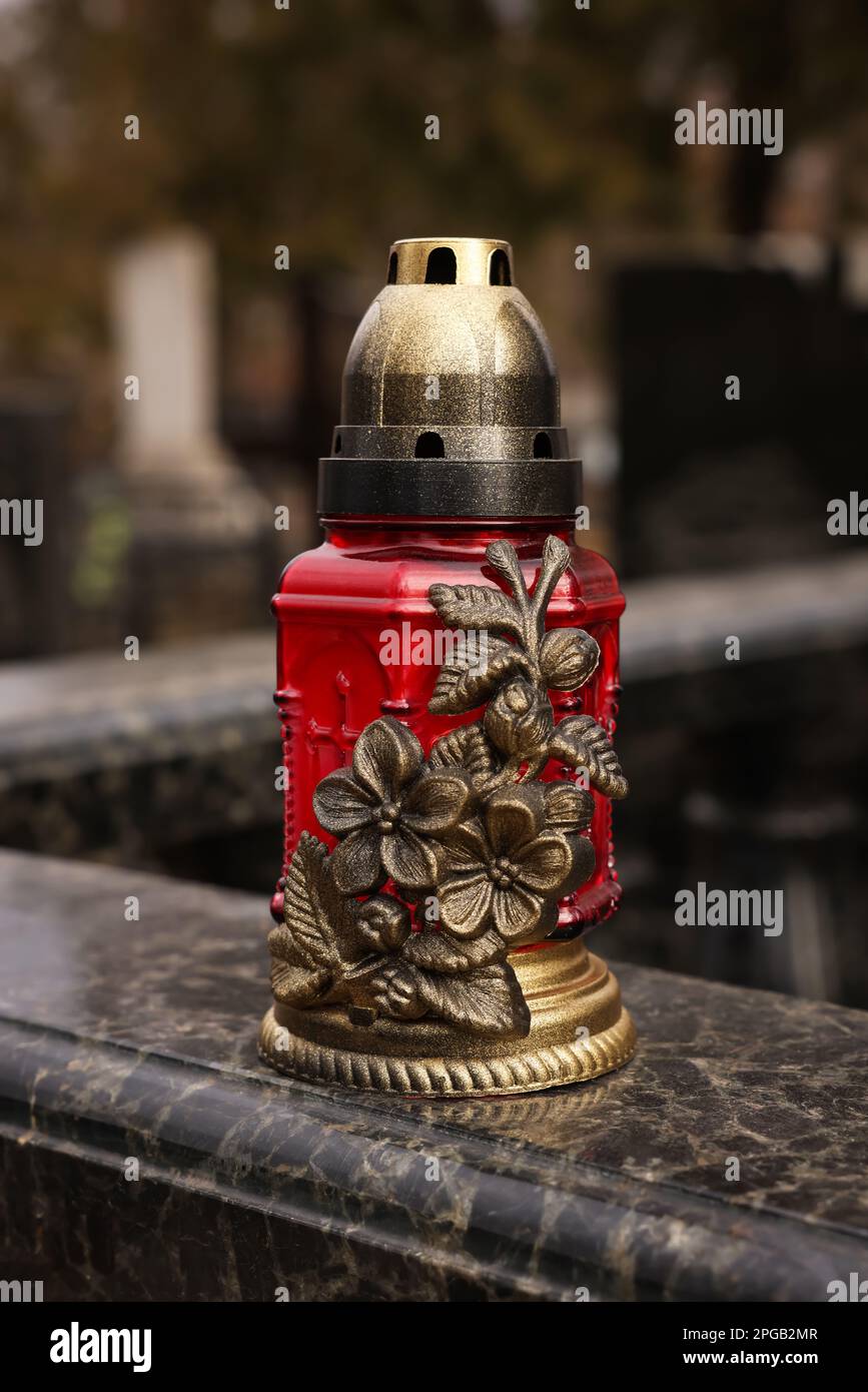 Grave lantern on granite surface at cemetery Stock Photo - Alamy