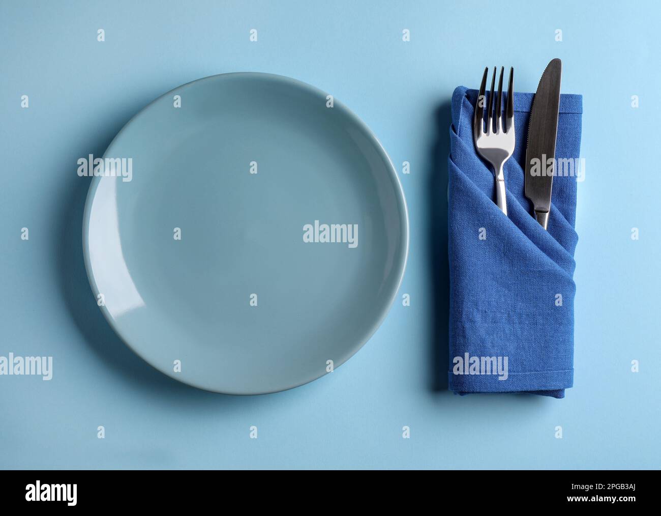 Beautiful table setting on light blue background, flat lay Stock Photo ...