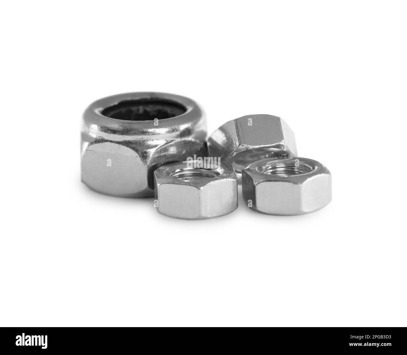 Different metal hex nuts on white background Stock Photo - Alamy