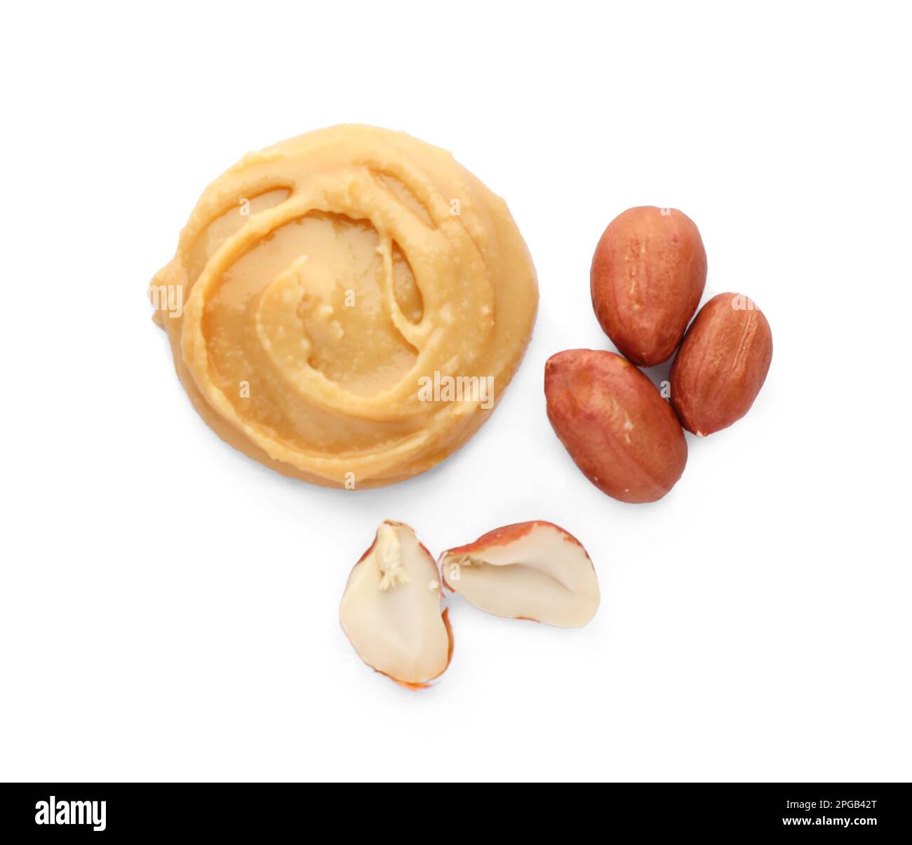 Creamy peanut butter and nuts on white background, top view Stock Photo ...