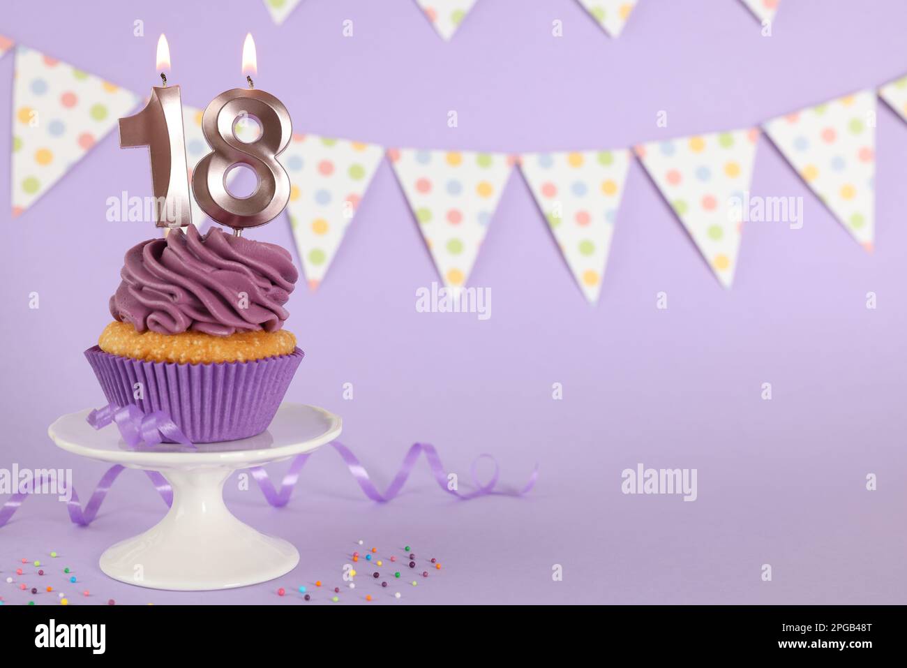 Coming of age party - 18th birthday. Delicious cupcake with number ...