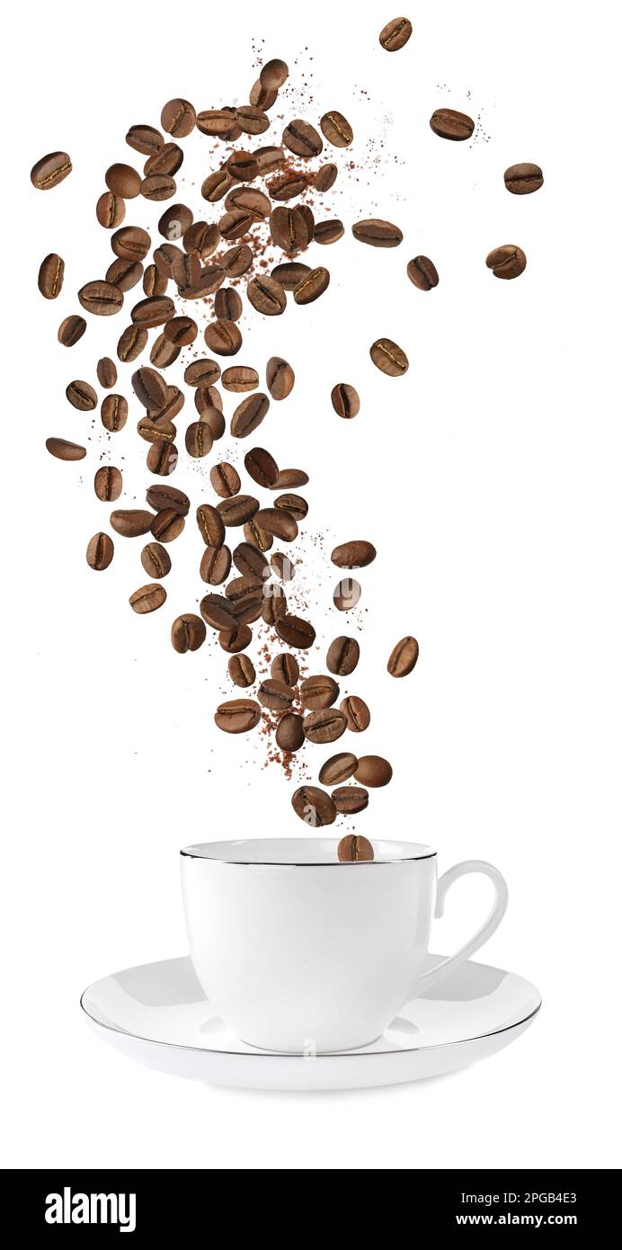 Aromatic roasted coffee beans falling into cup on white background ...