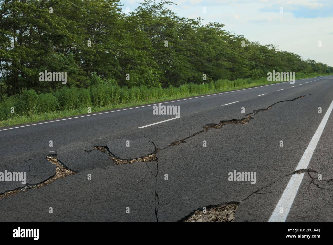 Large cracks on asphalt road after earthquake Stock Photo - Alamy