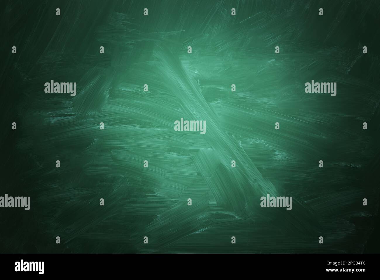 Dirty green chalkboard as background. Vignette effect Stock Photo - Alamy