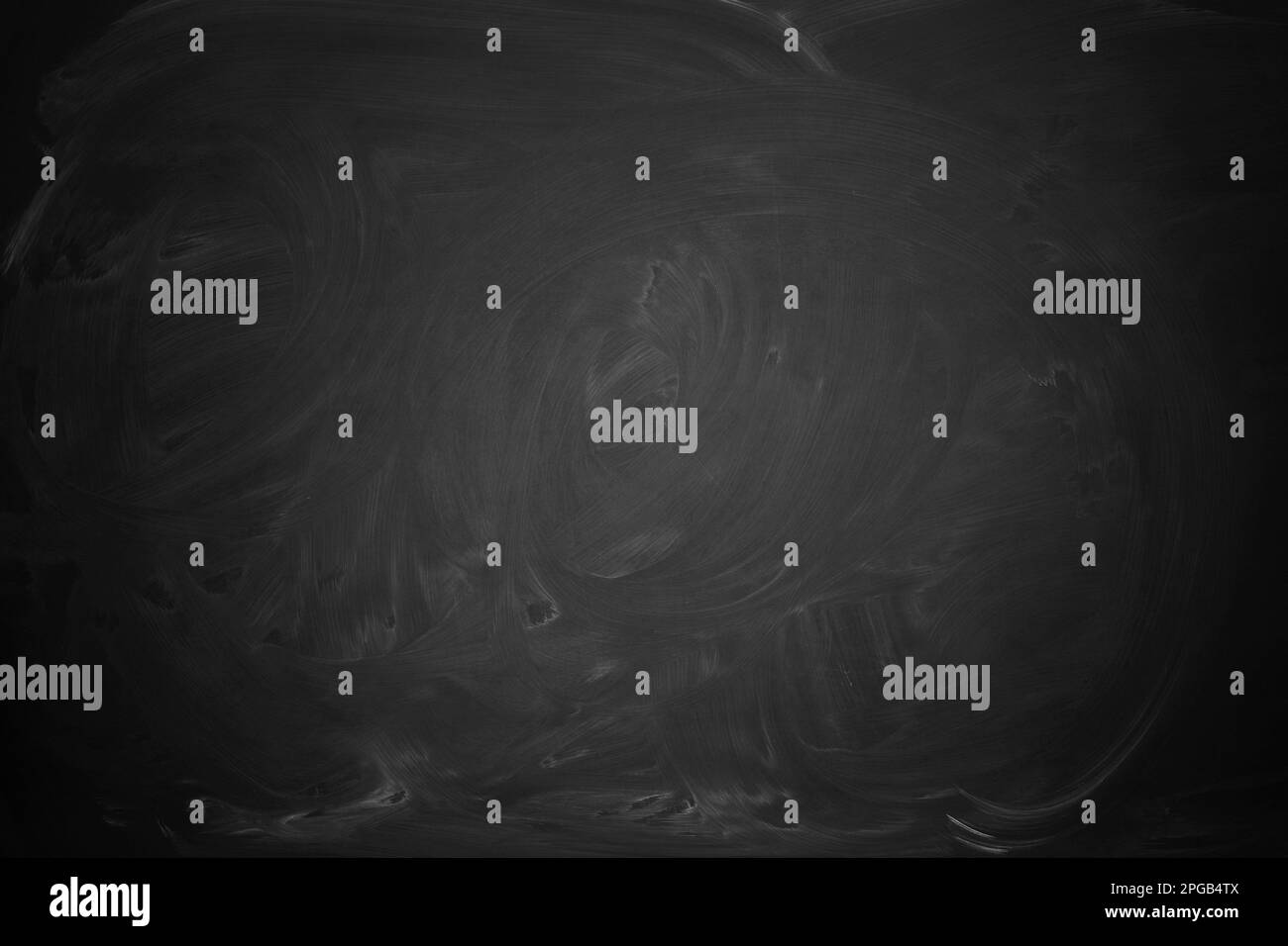 Dirty black chalkboard as background. Vignette effect Stock Photo - Alamy