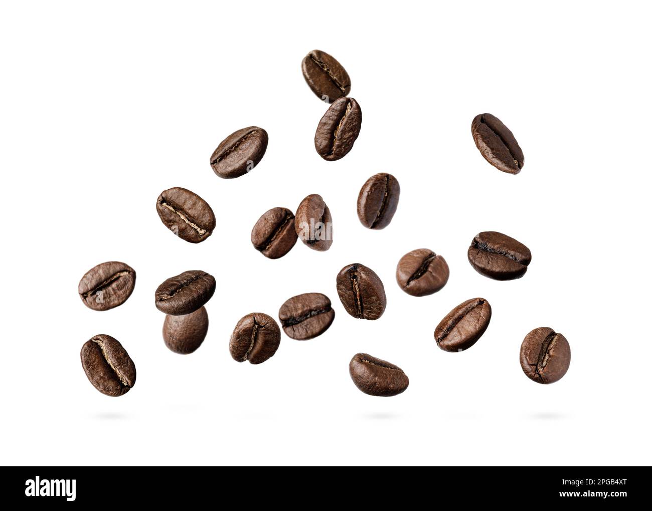 Many roasted coffee beans flying on white background Stock Photo - Alamy