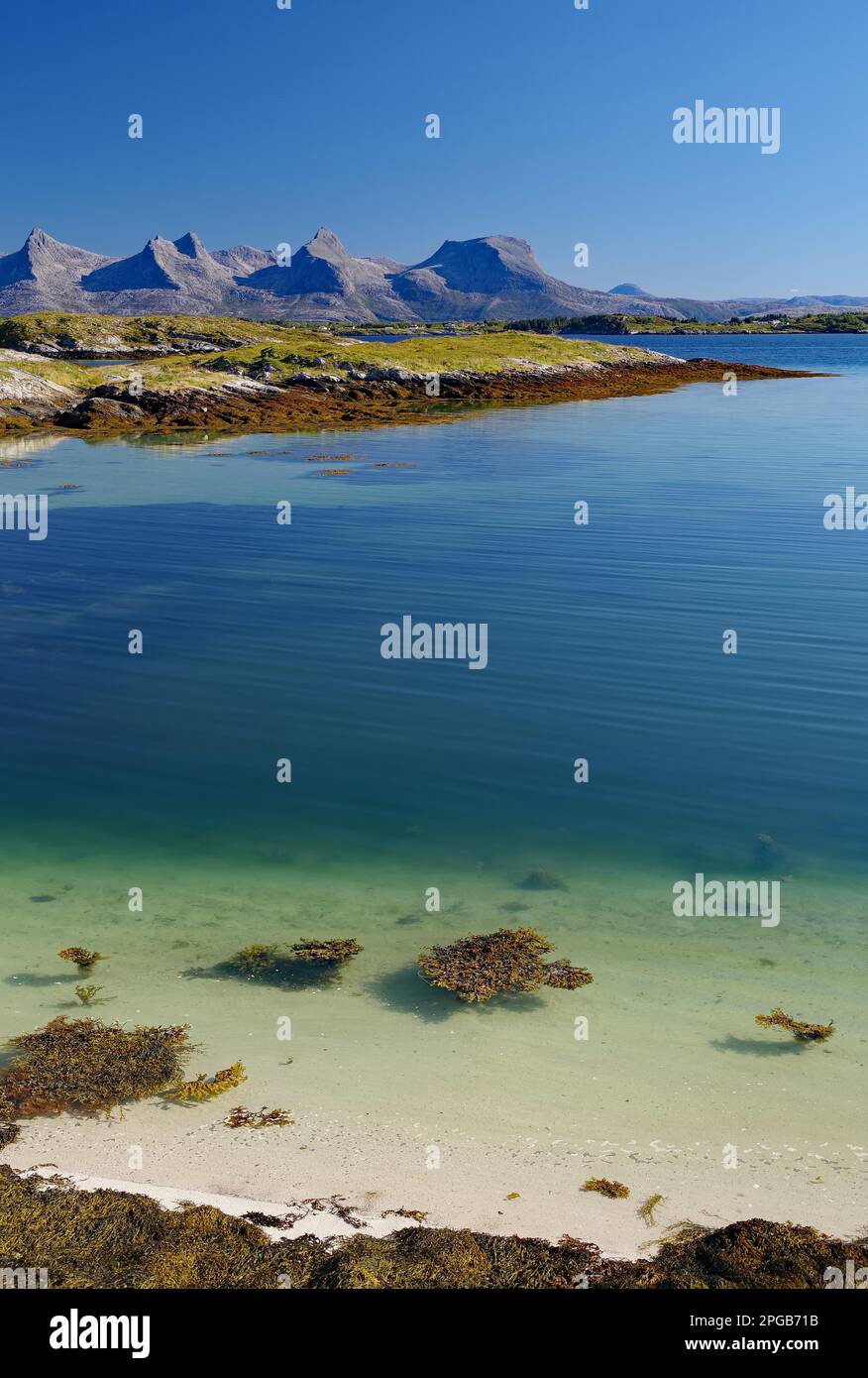 Crystal clear water in a shallow bay, sandy beach, view of the coastal ...