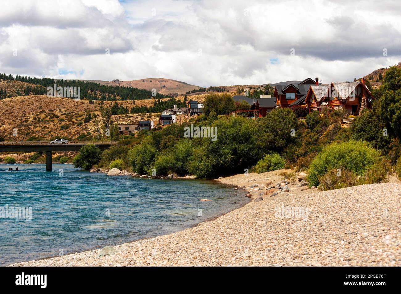 Beautiful houses at the Limay River, marking the border between Neuquén ...