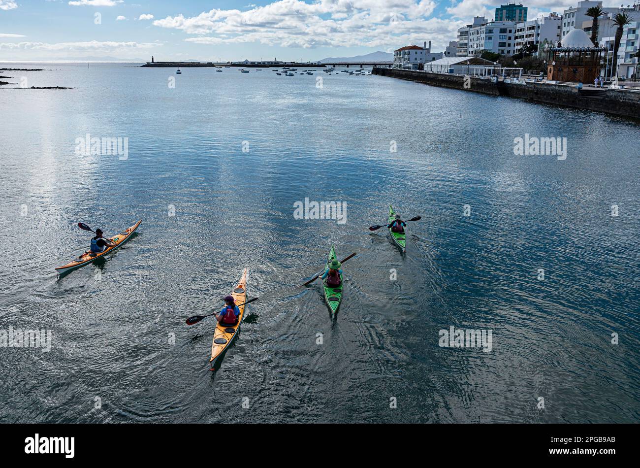 Paddle boats in the lagoon Charco de San Gines, fishing boats, Arrecife ...