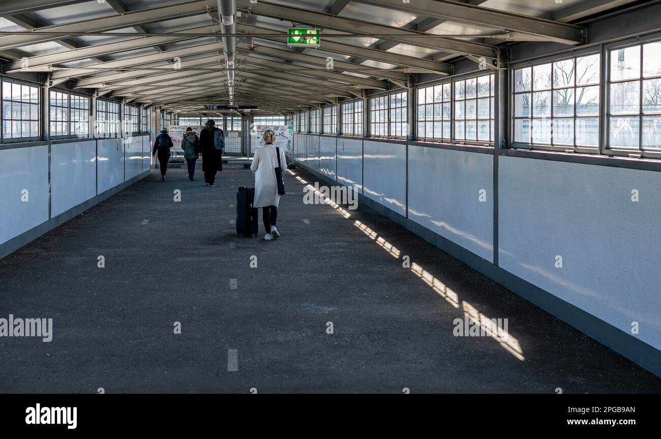 Travellers, connecting bridge at Ostkreuz station, Friedrichshain ...