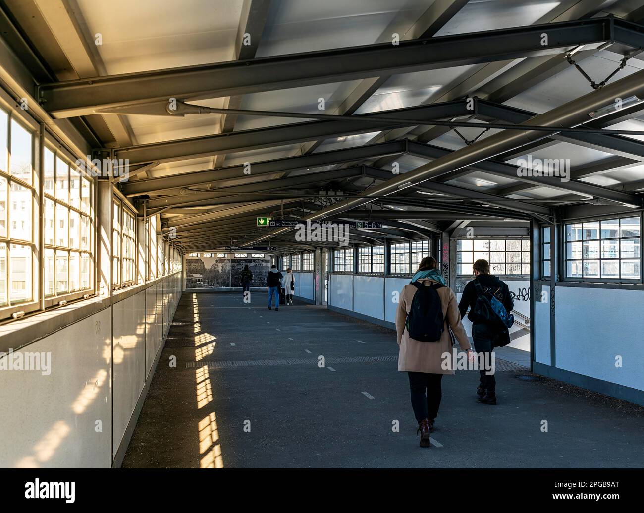 Travellers, connecting bridge at Ostkreuz station, Friedrichshain ...