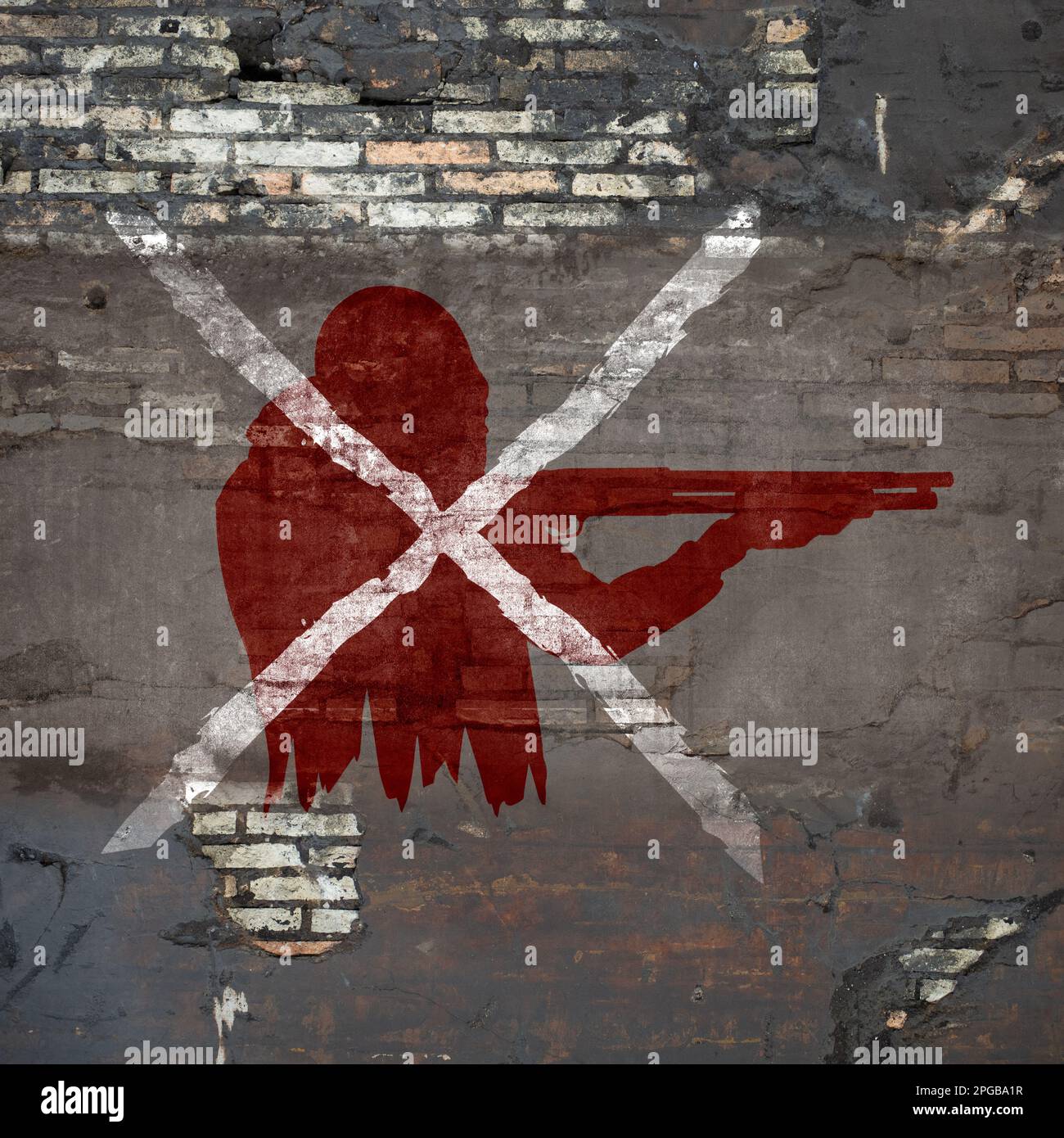 Symbol of a man holding a gun with a stop terrorism sign on the wall ...