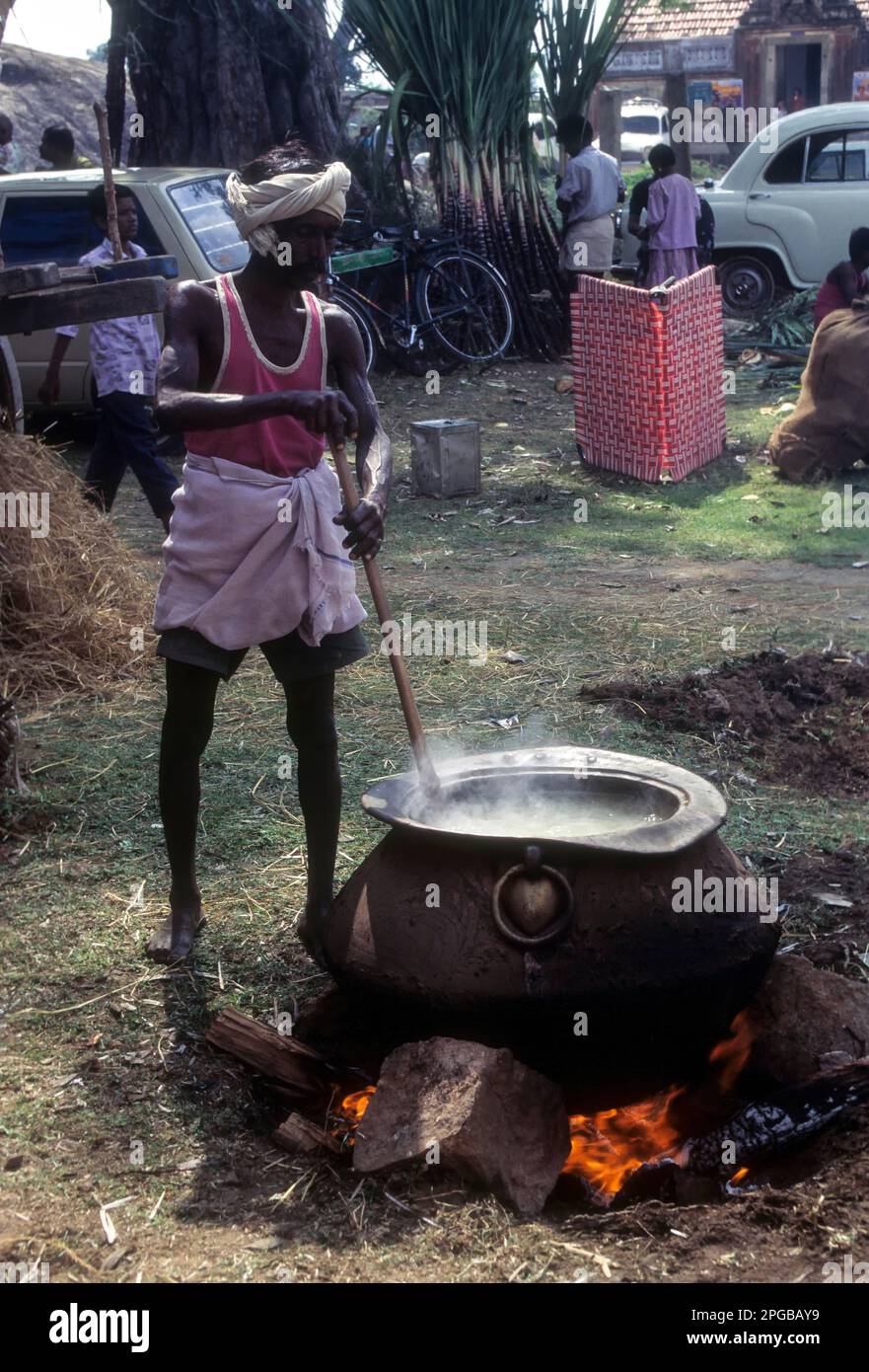 Rice cooking on a Anda (a big sized copper vessel) for a temple feast ...