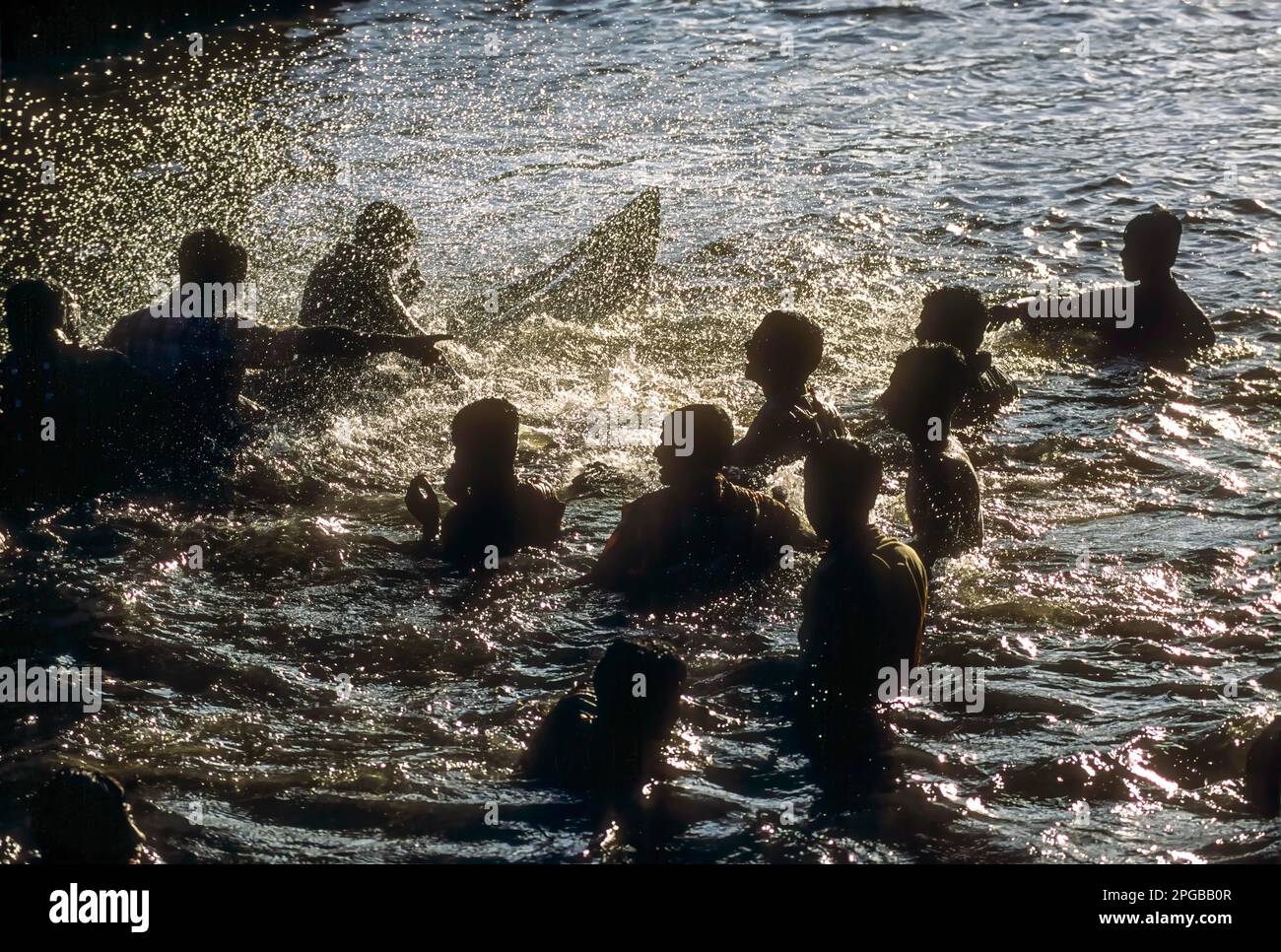 Audience playing with water during the Snake boat race at Payippad near ...