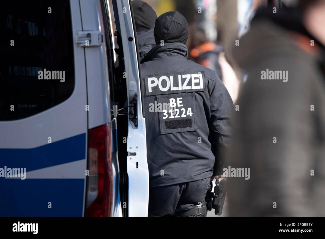 Policeman, police lettering, Berlin, Germany Stock Photo - Alamy