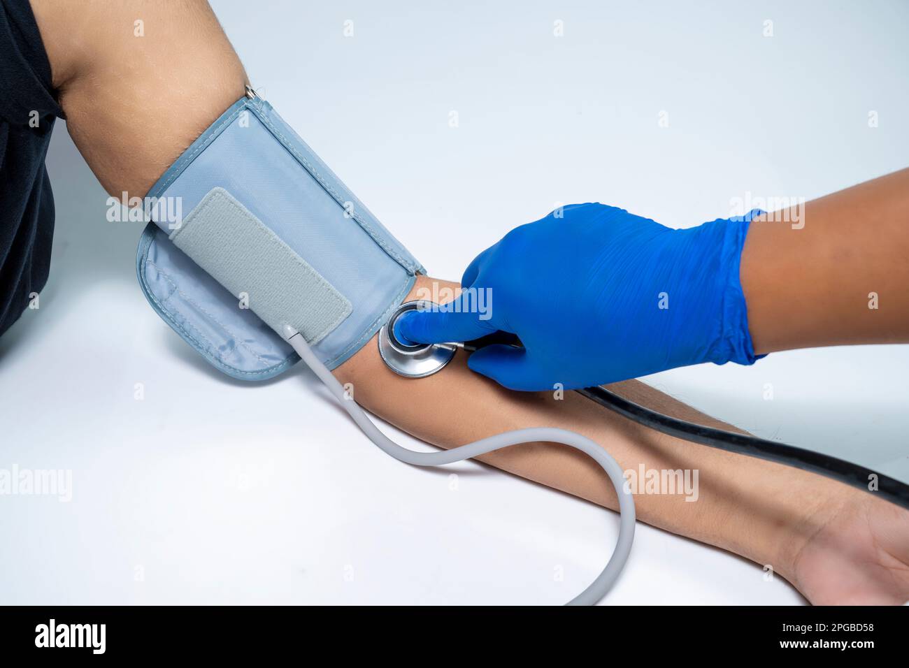 Doctor checking patient blood pressure with digital monitor Stock Photo ...