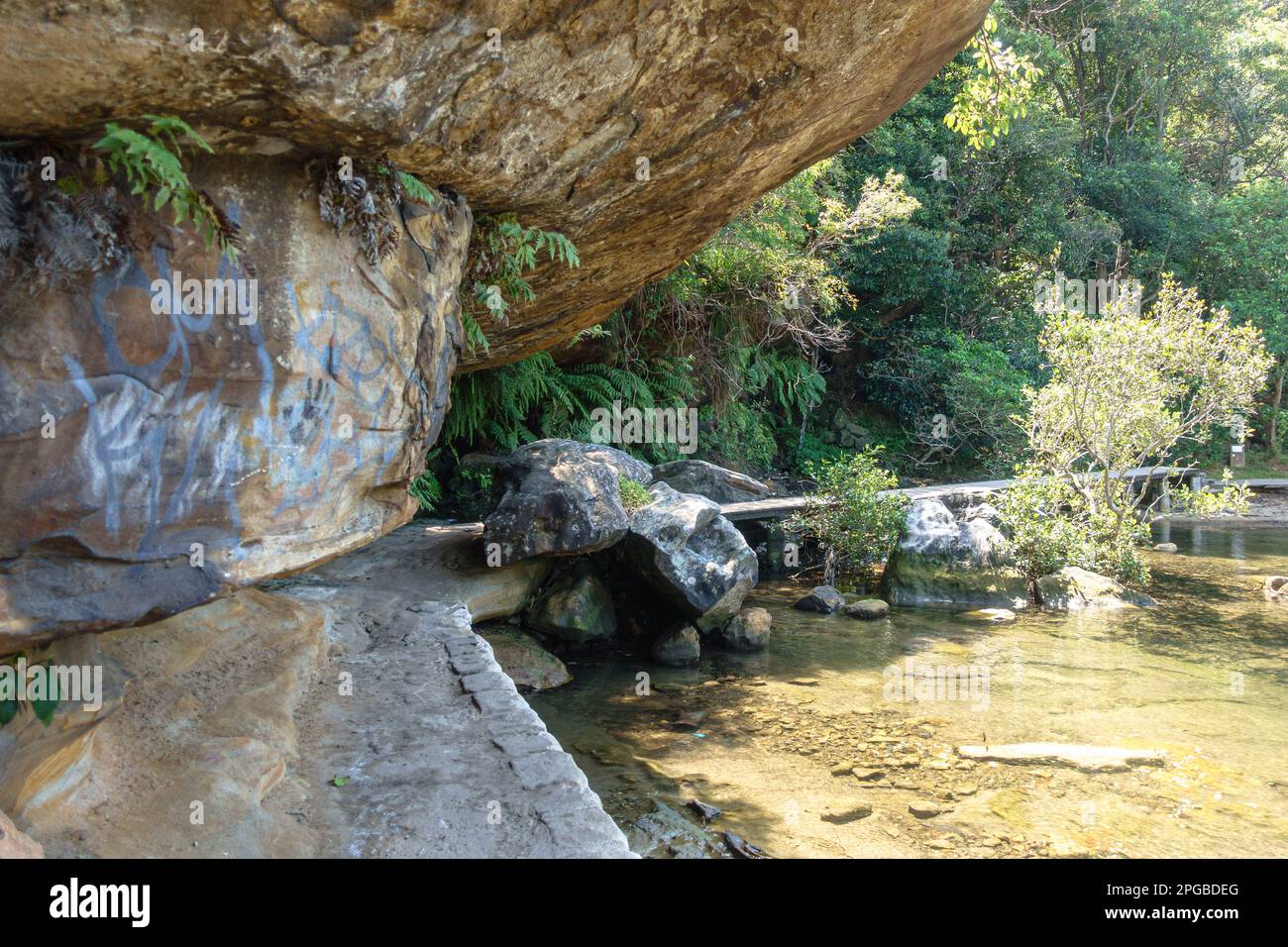 Rocks overhanging the Manly to Spit Walk at Shell Cove in the Middle ...