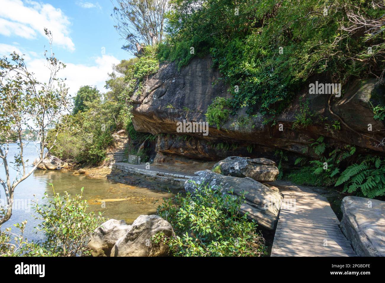 Rocks overhanging the Manly to Spit Walk at Shell Cove in the Middle ...