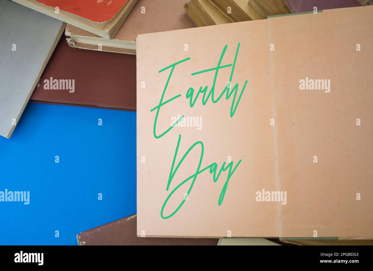 Earth Day word in opened book with vintage, natural patterns old ...