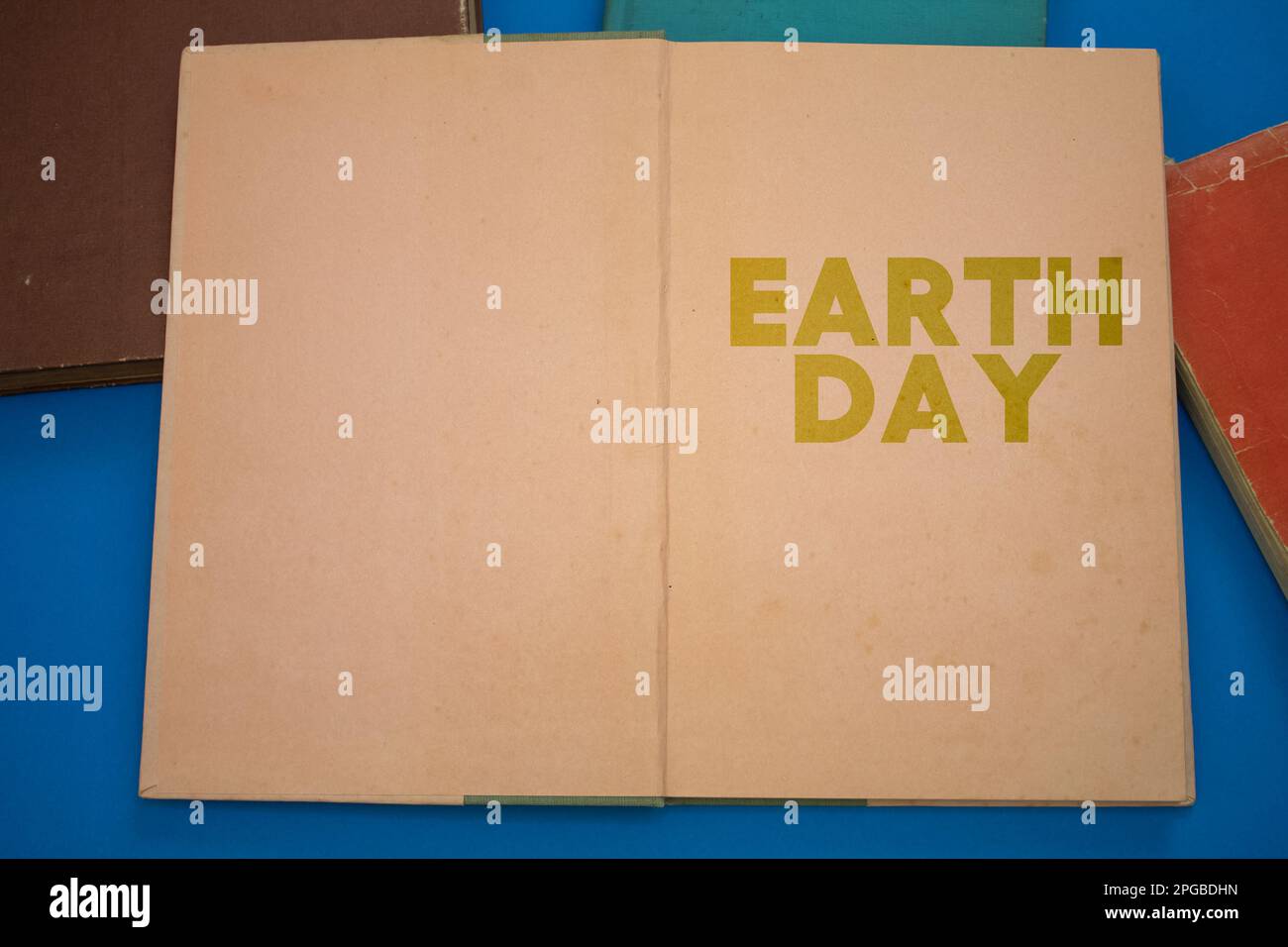 Earth Day word in opened book with vintage, natural patterns old ...