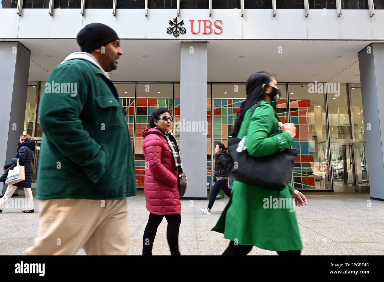 New York, USA. 21st Mar, 2023. People walk past Investment banking ...