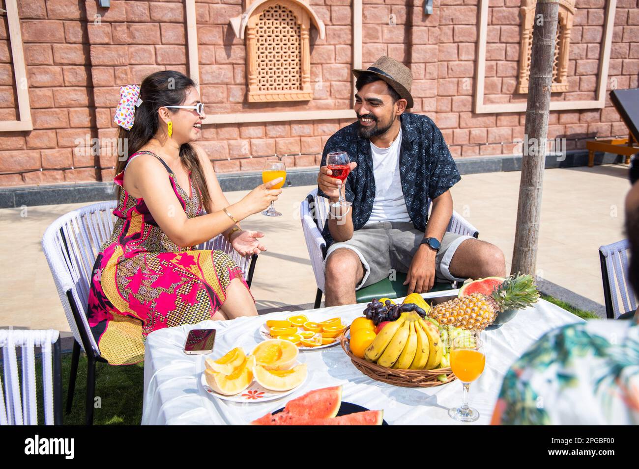 Young couple drinking juice restaurant hi-res stock photography and ...