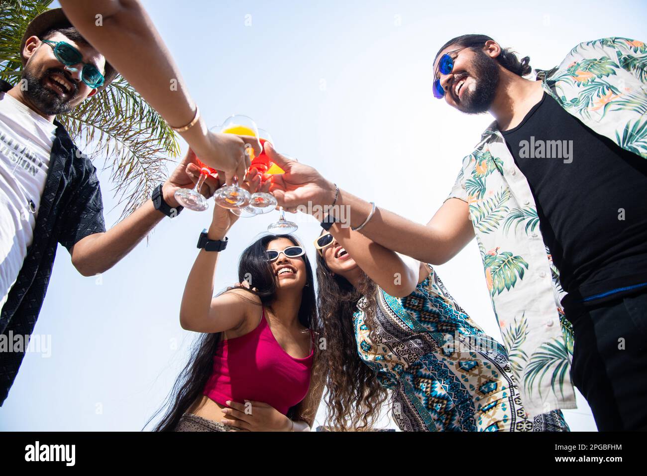 Indian Friends Having Fun Together Toasting Cocktail Drinks Summer