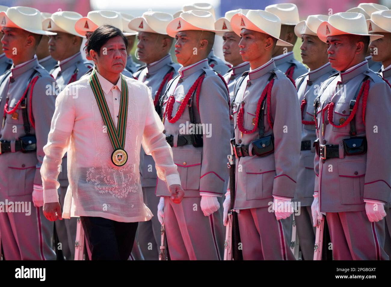 Philippine President Ferdinand Marcos Jr. walks beside Filipino ...