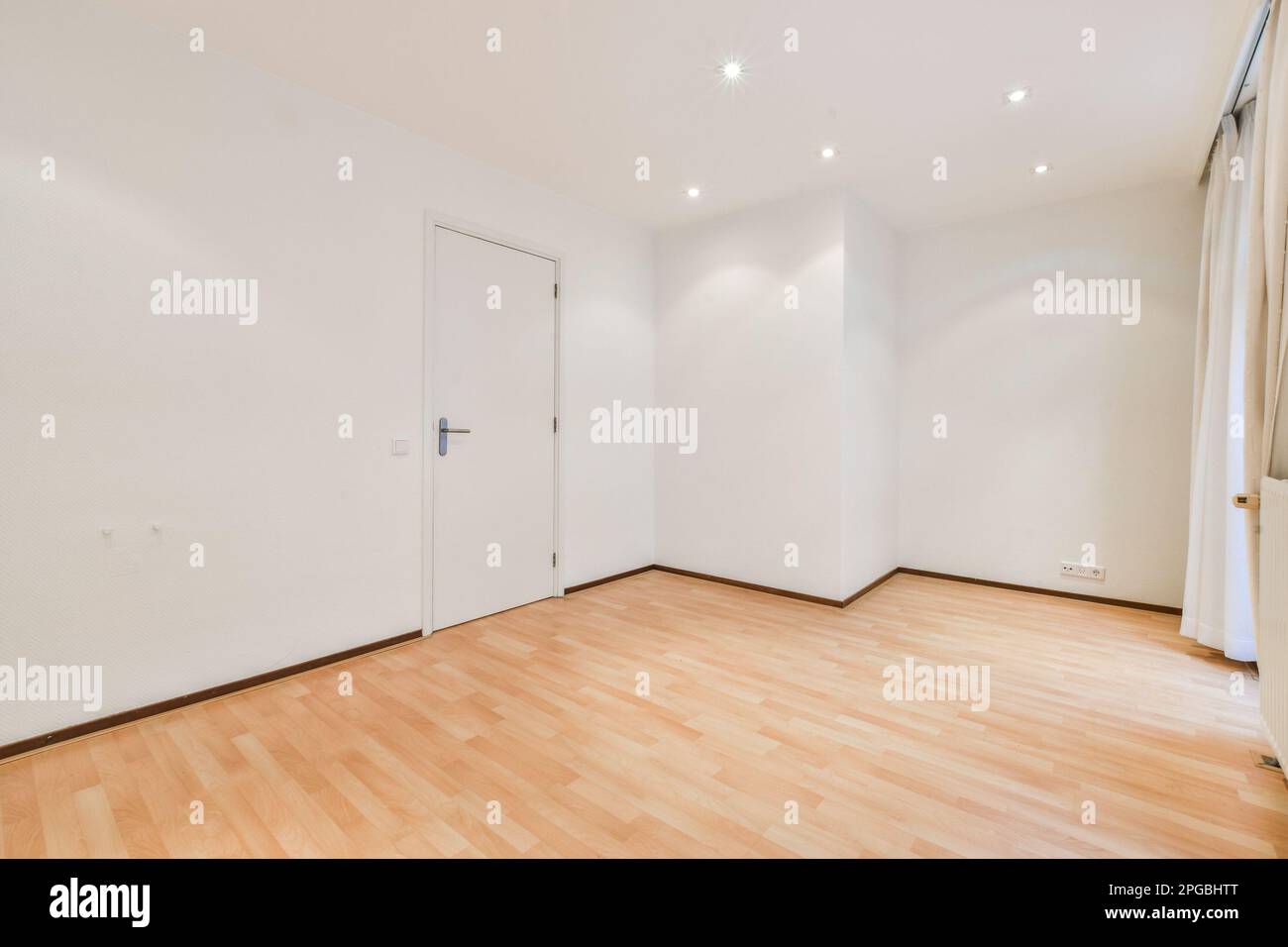 an empty room with wood flooring and white paint on the walls there is ...