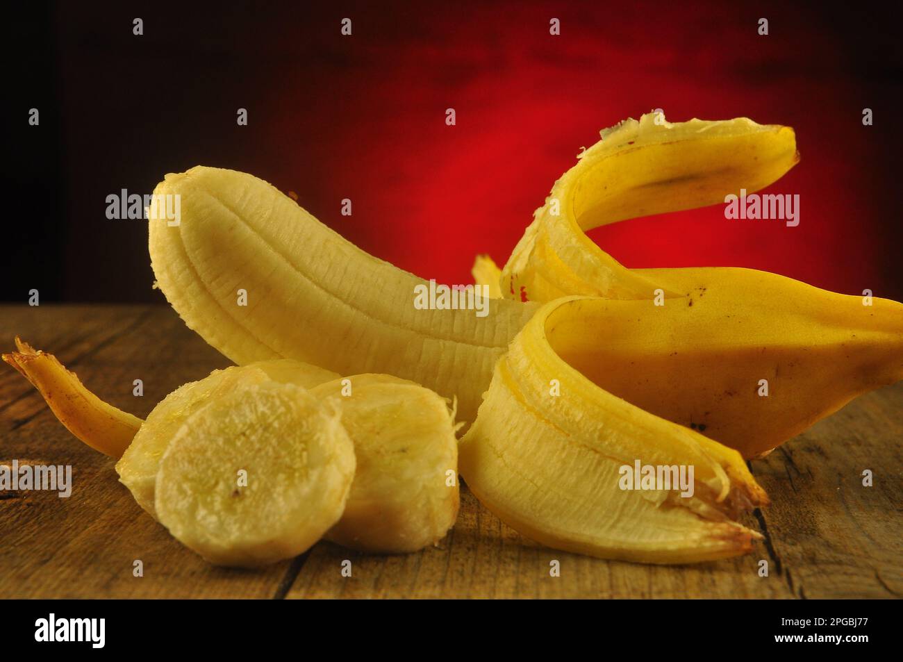 Peeled banana on studio shot Stock Photo - Alamy