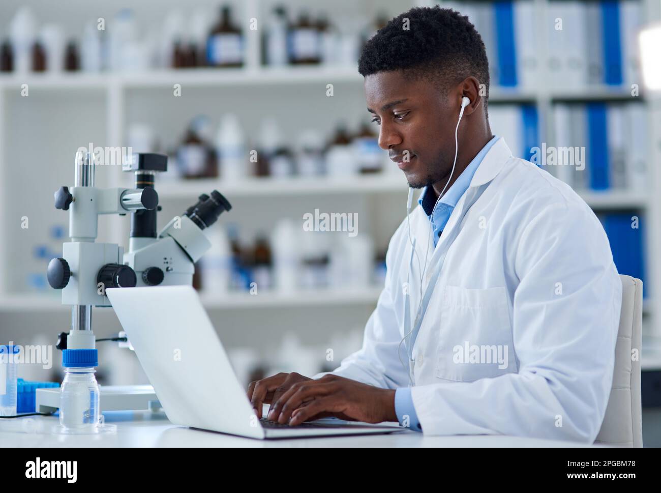 Crunching the numbers. a focused young male scientist working on his ...
