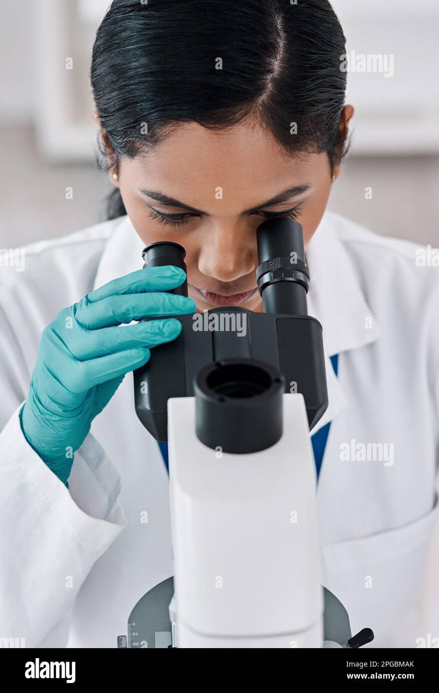 Attractive scientist woman looking under hi-res stock photography and ...