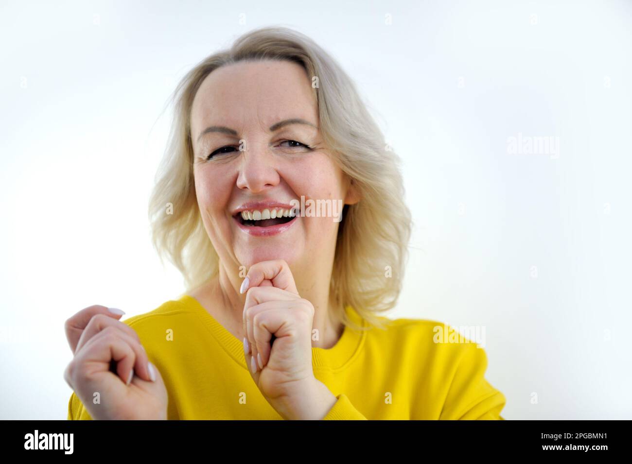 attractive woman wearing yellow t-shirt moving jumping forward with ...