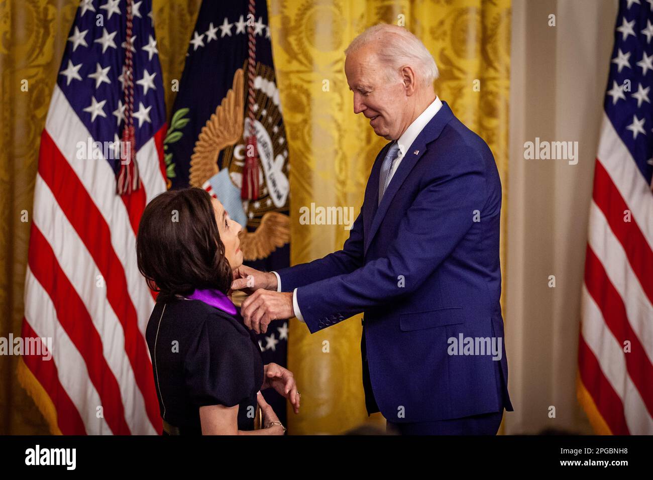 Washington, United States. 21st Mar, 2023. President Joe Biden presents ...