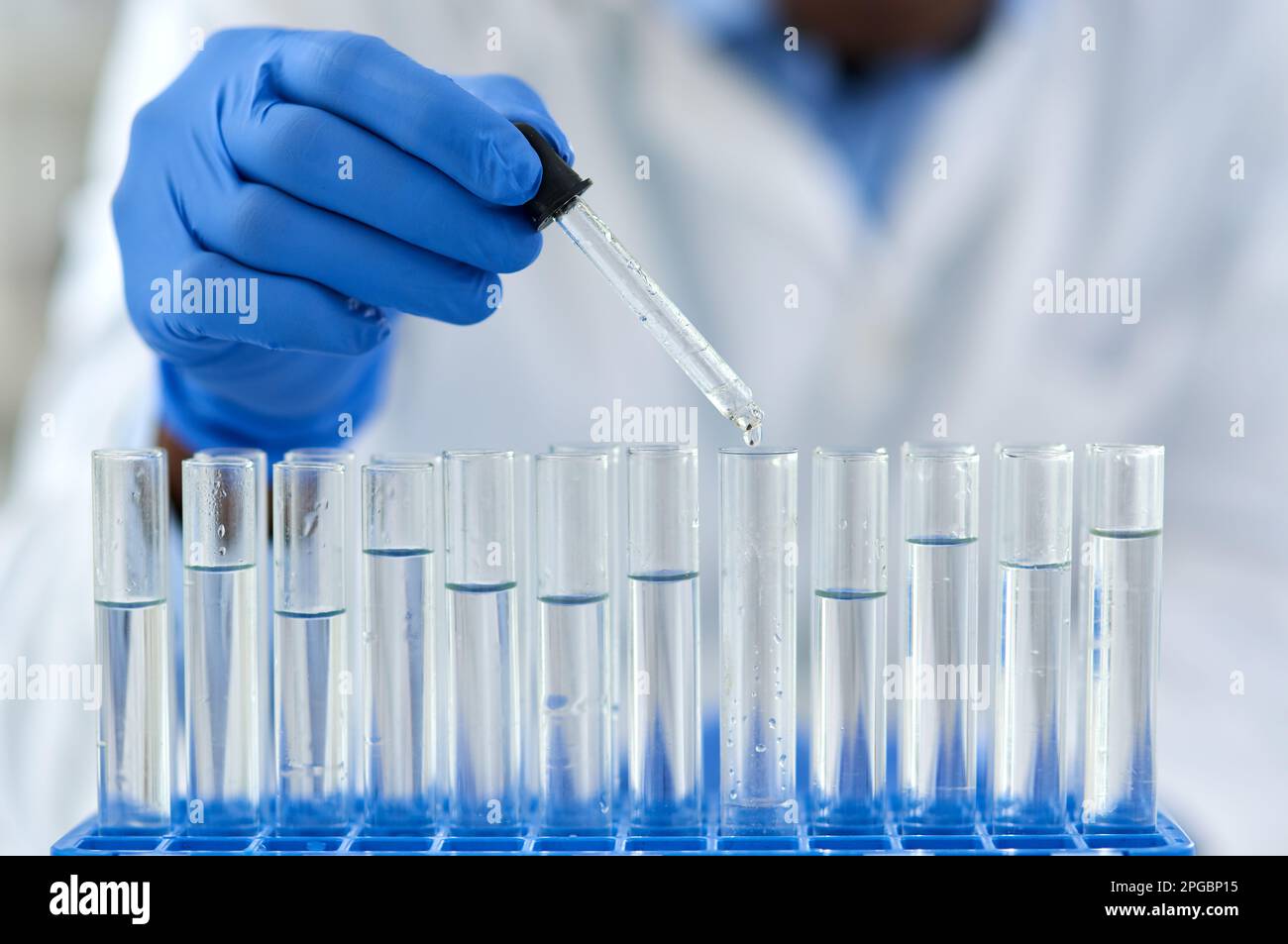 This is the last one. Closeup of an unrecognizable scientist pouring a ...