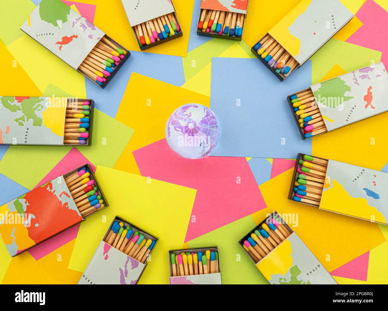a crystal earth globe surrounded by matchboxes world map with colored ...