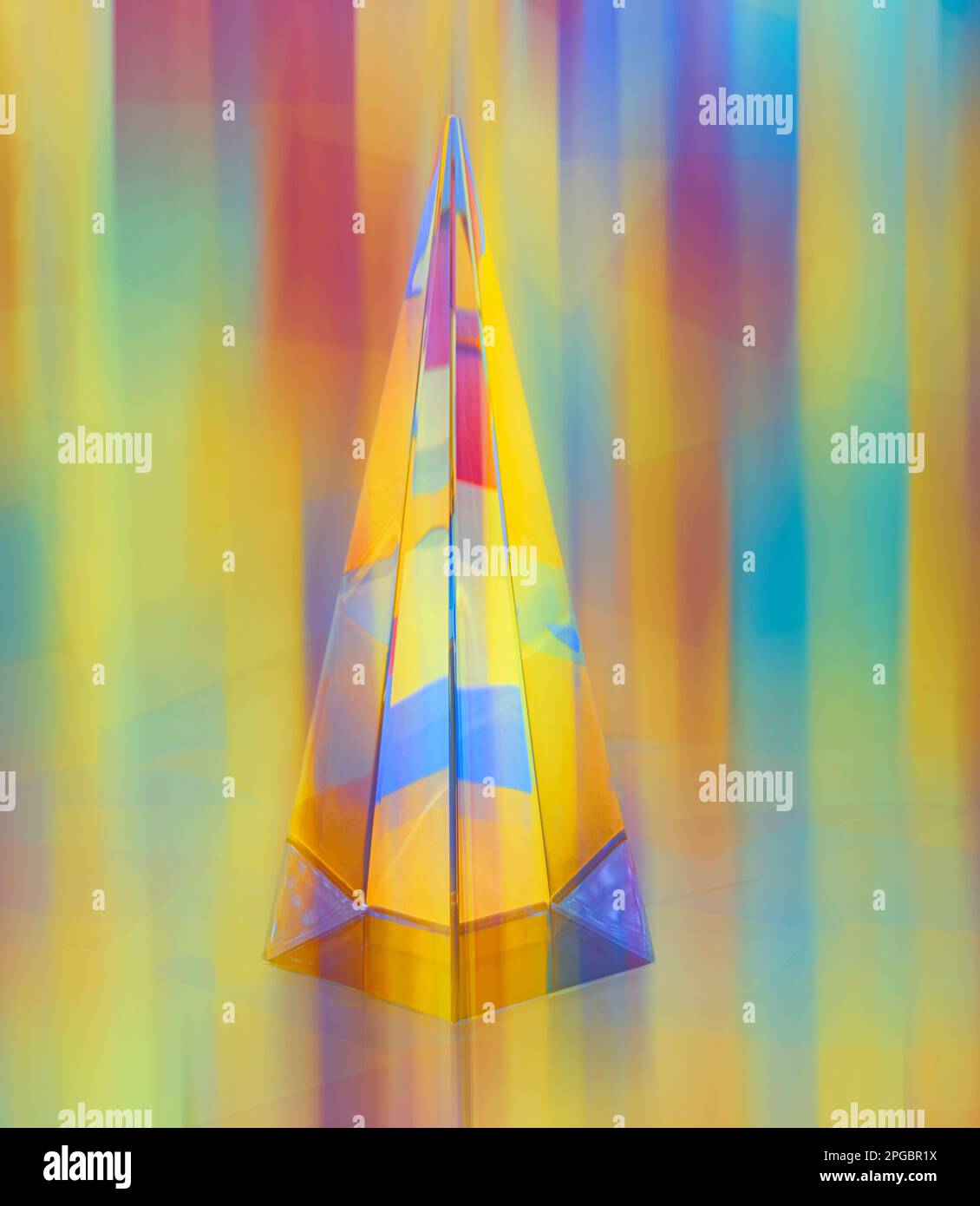 crystal pyramid on Colorful sticky notes in background, motion blur ...