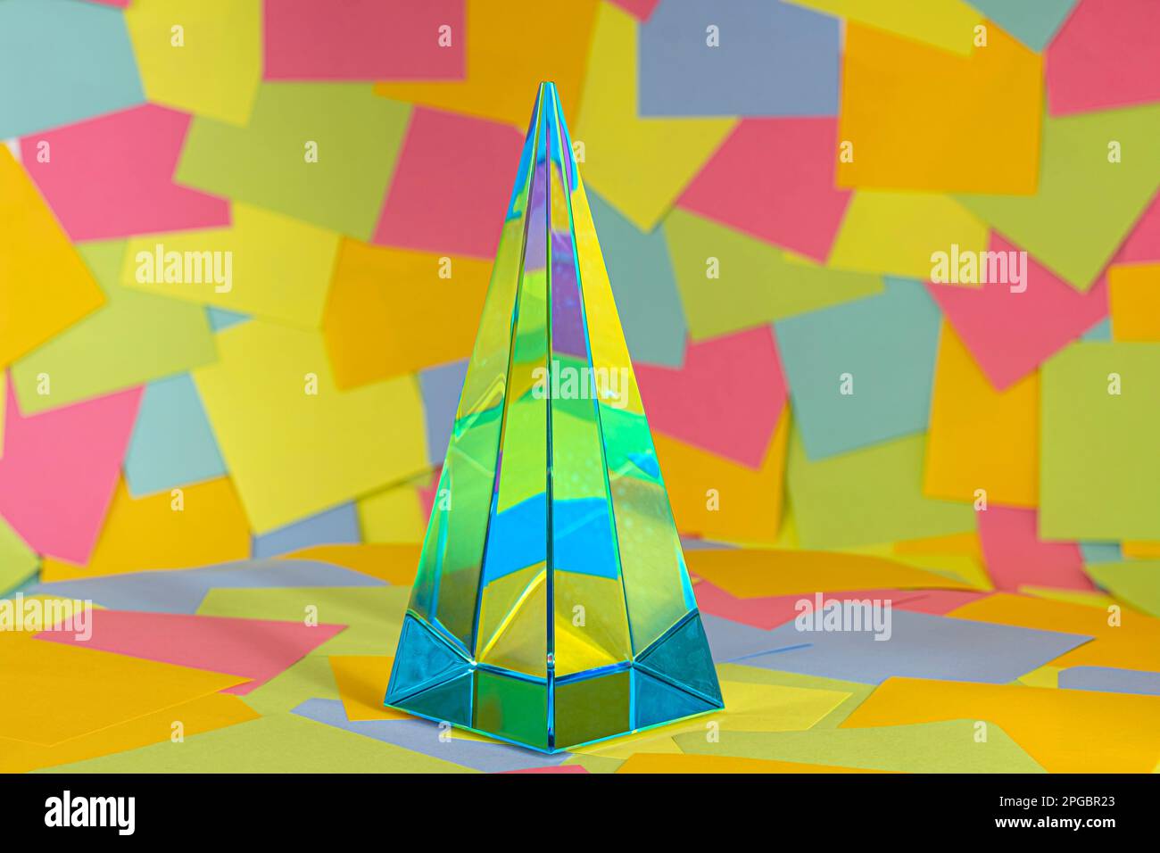 crystal pyramid on Colorful sticky notes in background Stock Photo - Alamy
