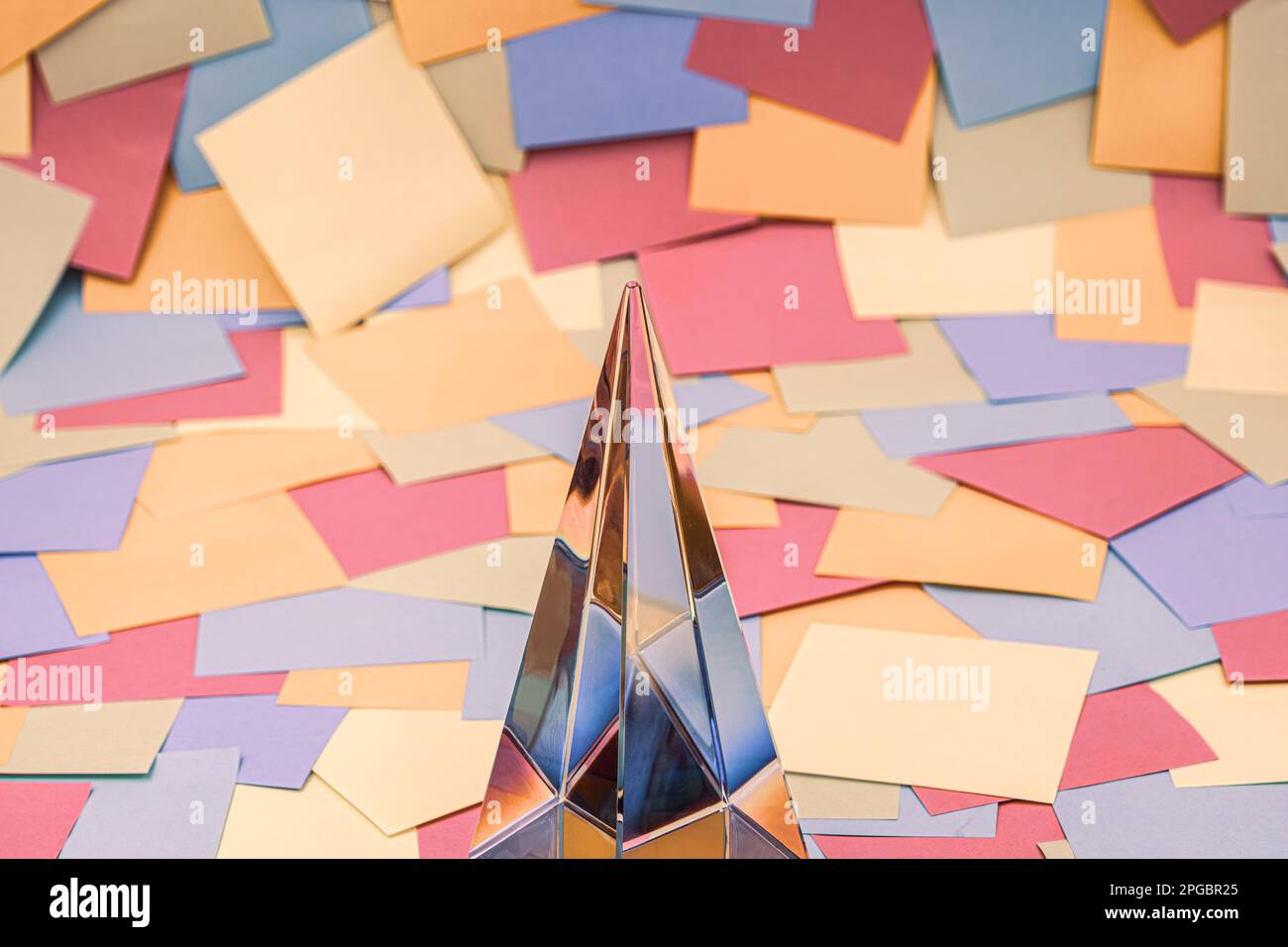 crystal pyramid on Colorful sticky notes in background Stock Photo - Alamy