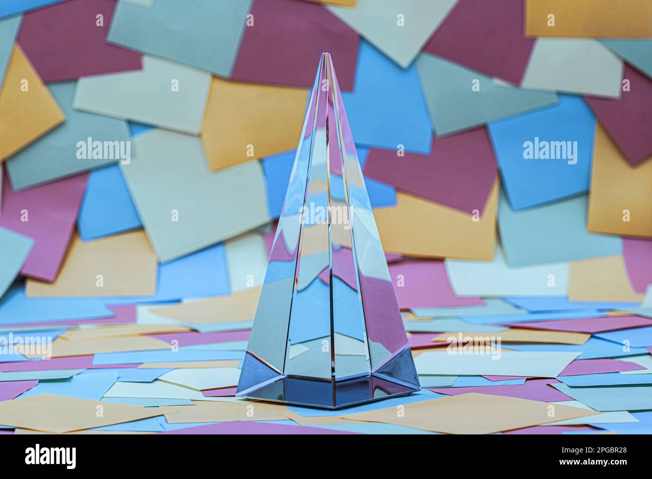 crystal pyramid on Colorful sticky notes in background Stock Photo - Alamy