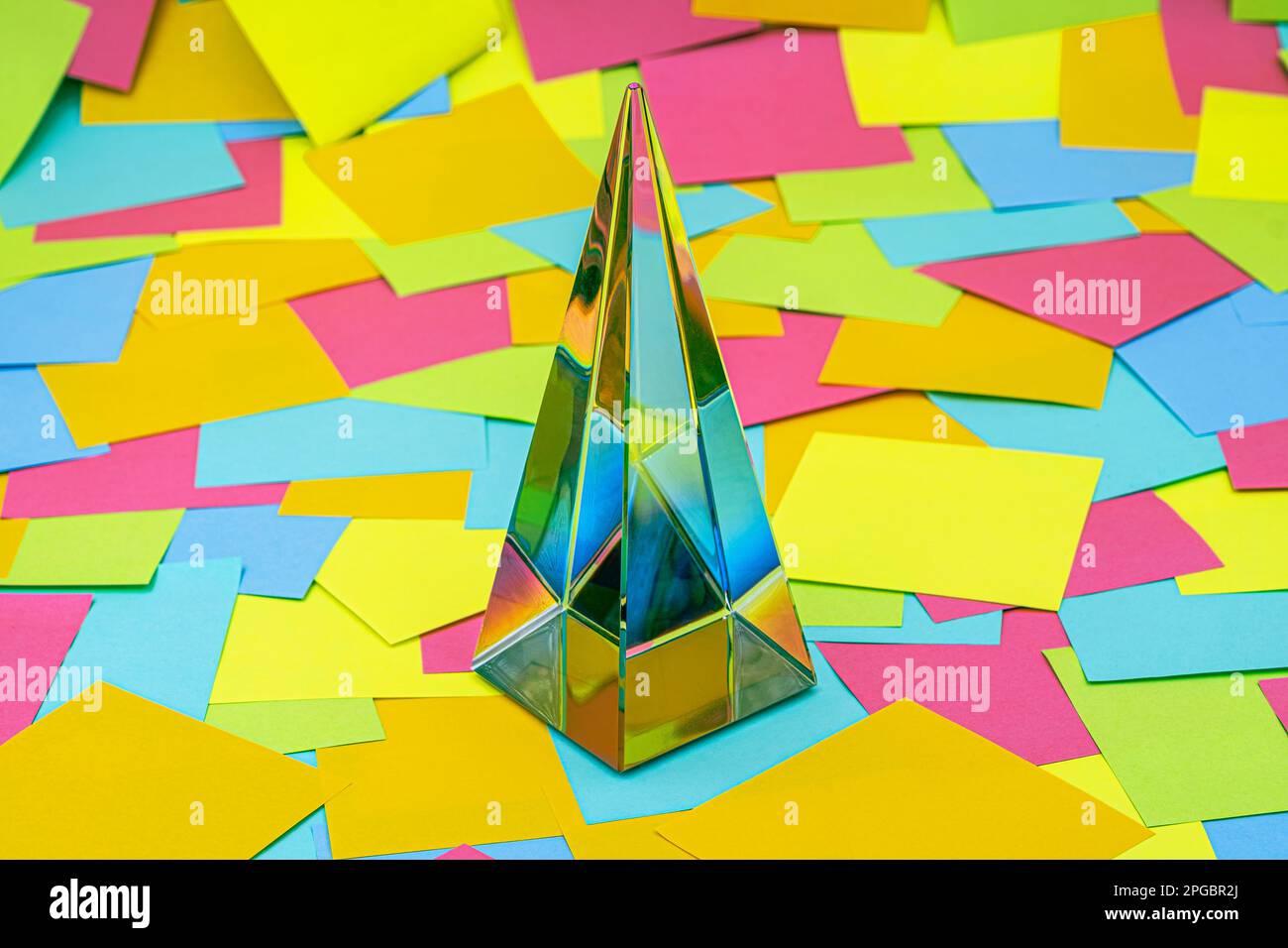 crystal pyramid on Colorful sticky notes in background Stock Photo - Alamy